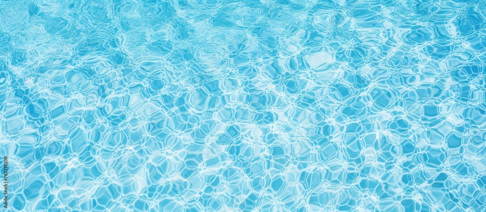 Close up of the liquid azure water in a swimming pool, creating an ...