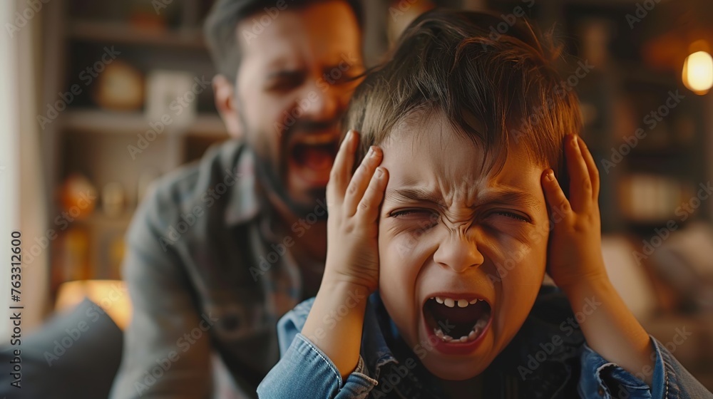 A dad is yelling at the kid. The little boy covers his ears and cry ...