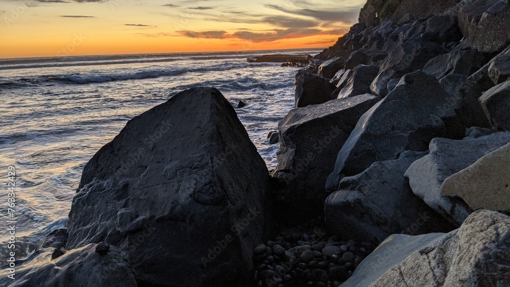 The Melted Rocks of Swamis Beach. Erosion control boulders put down ...