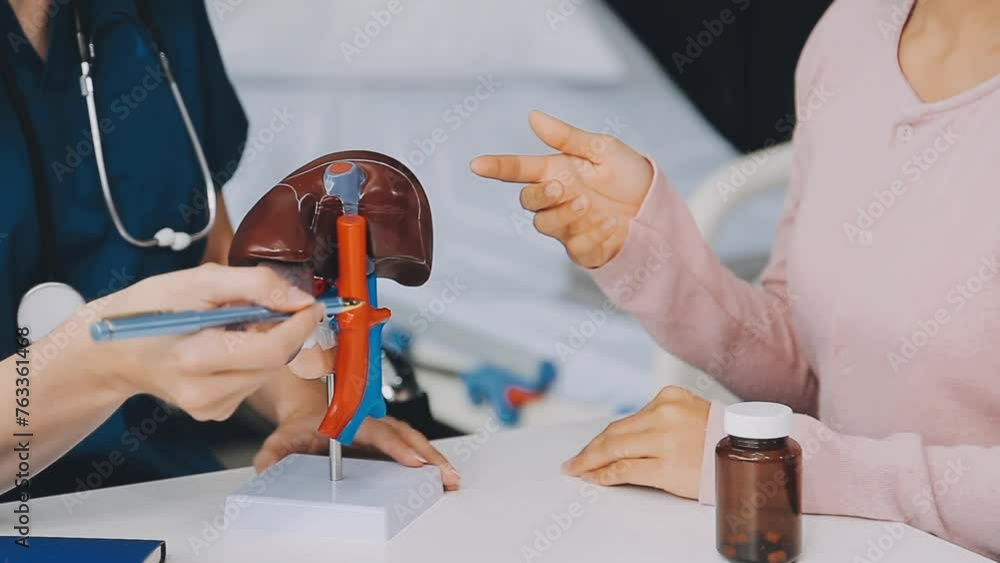 Gastroenterologist doctor explaining liver and gallbladder problems ...