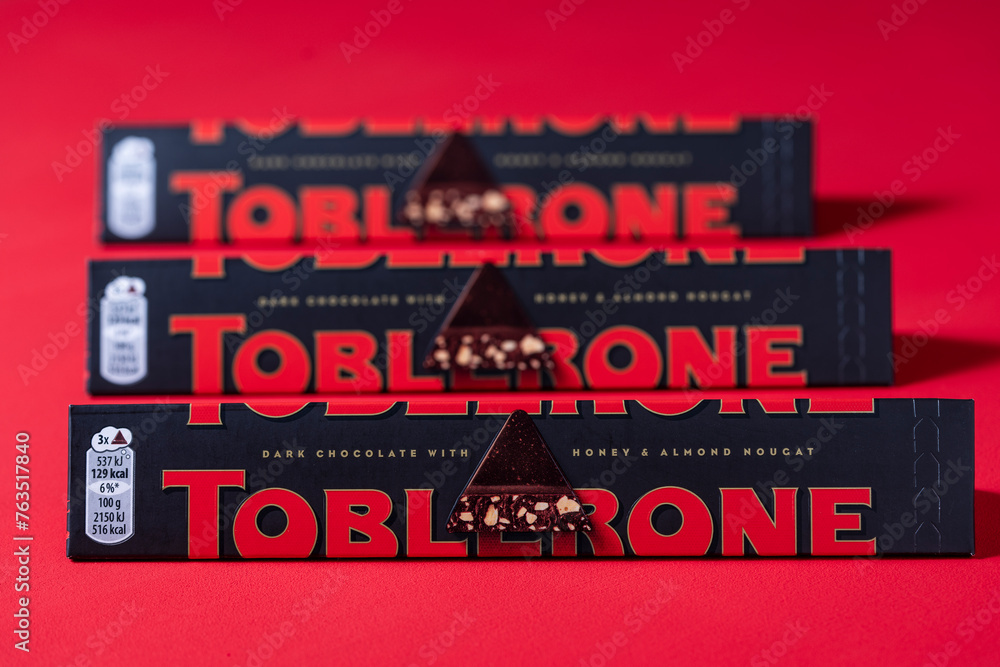 Toblerone Swiss Dark Chocolate with Honey and Almond Nougat on a red ...