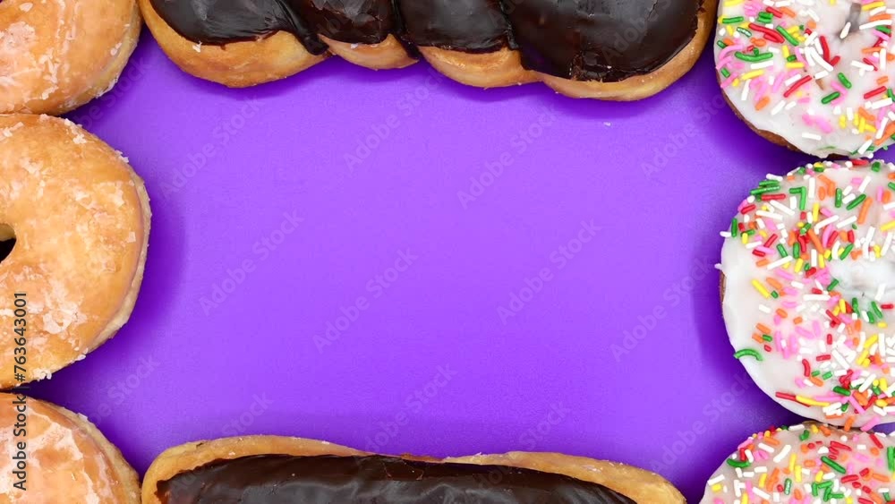 4K HD video zooming out on various frosted and glazed donuts, chocolate ...