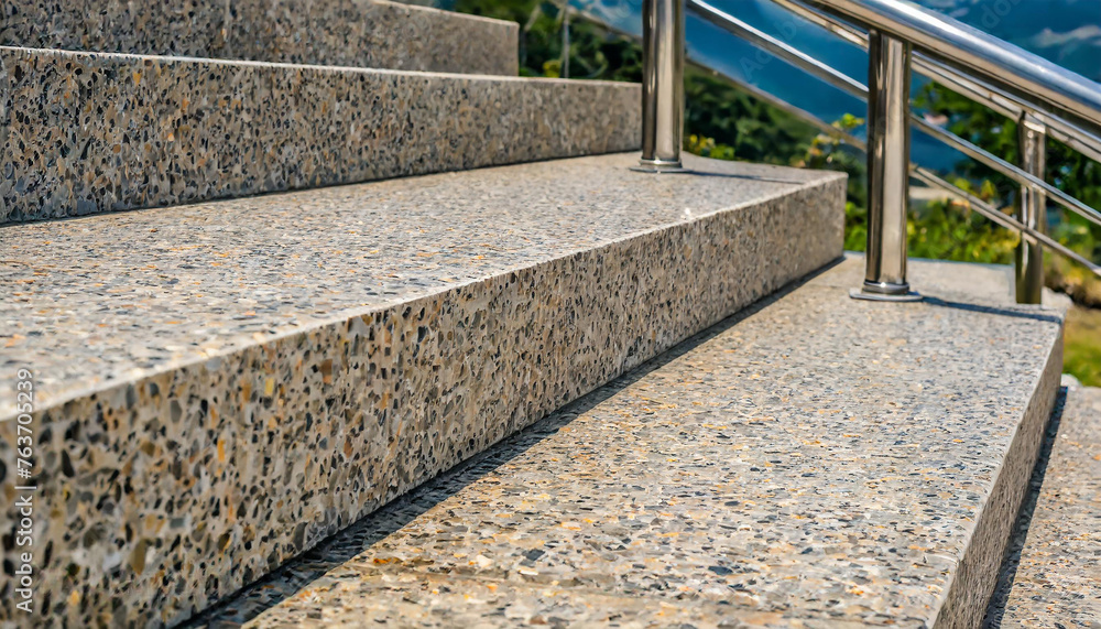 Outdoor concrete stair covered with rough granite tiles. Step of ...