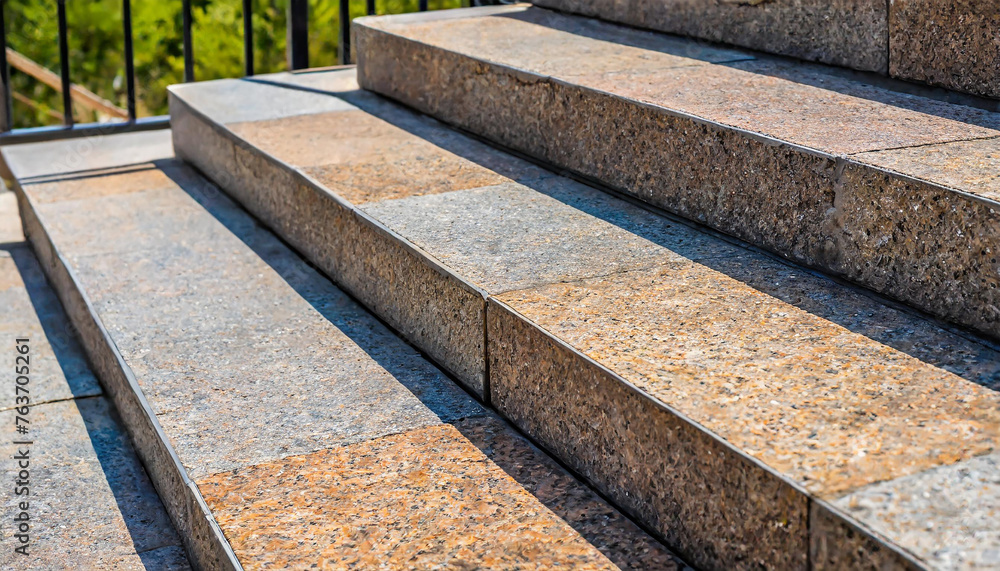 Outdoor concrete stair covered with rough granite tiles. Step of ...