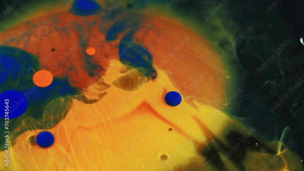 Paint splash. Oil bubbles. Ink water mix. Defocused orange blue color ...
