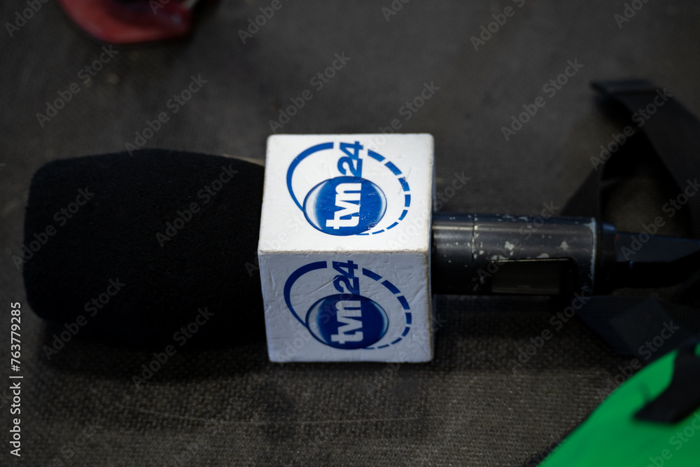 Microphone with logo sign of TVN24 TV network company. Polish news ...