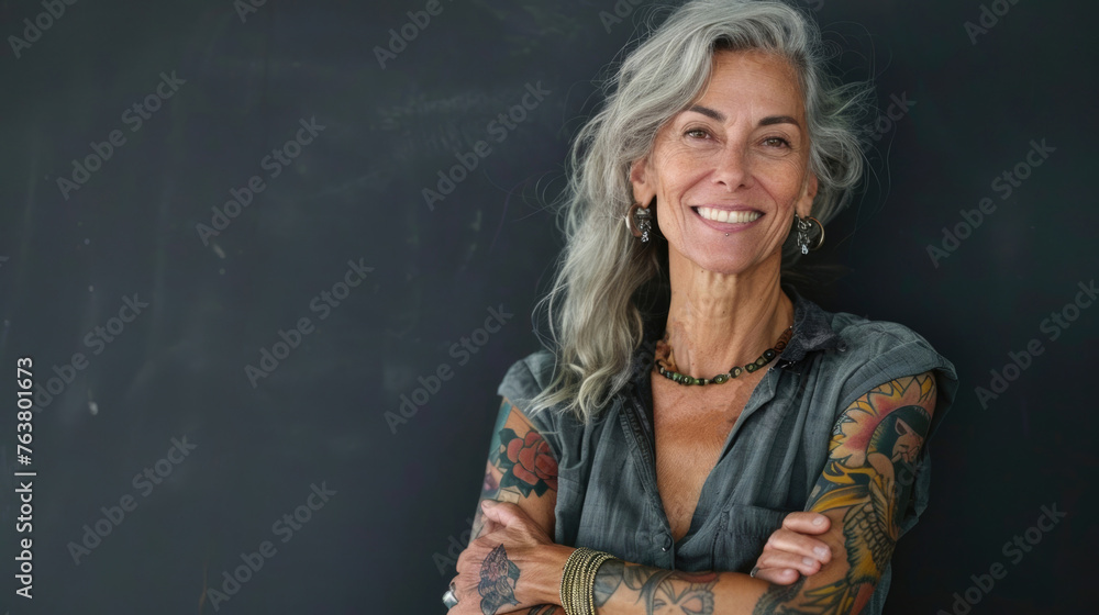 Beautiful retired pensioner woman with gray hair. Tattooed fashionable ...