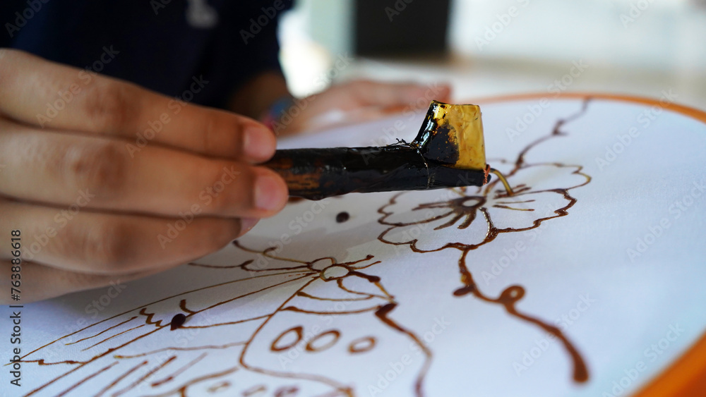 Batik making process, a handmade traditional art from Indonesia. Person ...