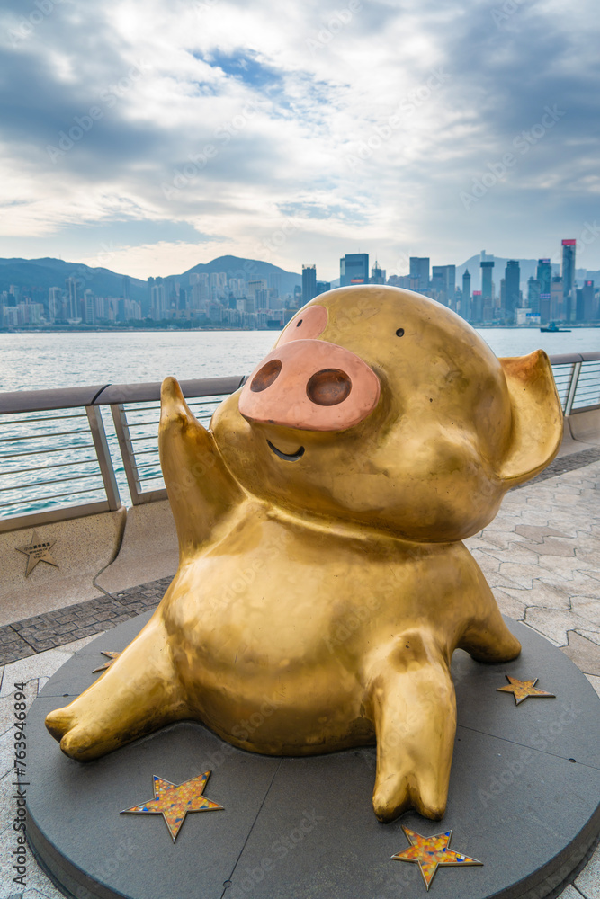 A bronze sculpture of McDull, an anthropomorphic pig cartoon character ...
