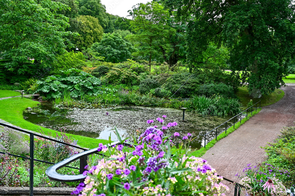 Sofiero Palace Gardens, green park with paths and large trees in Sofiero Castle, Sofiero Slott ...