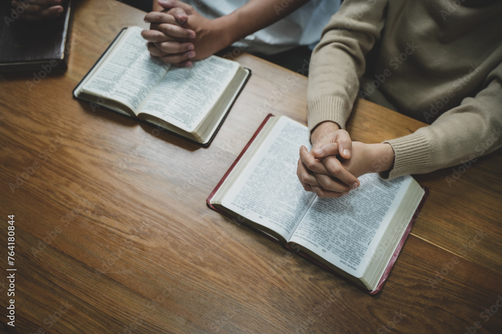 Christians and prayers Group of Christians holding hands praying for ...