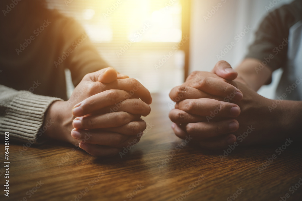 Christians and prayers Group of Christians holding hands praying for ...