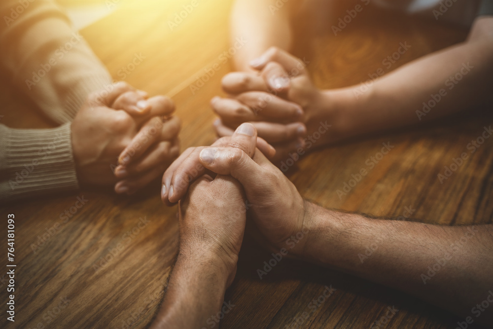 Christians and prayers Group of Christians holding hands praying for ...