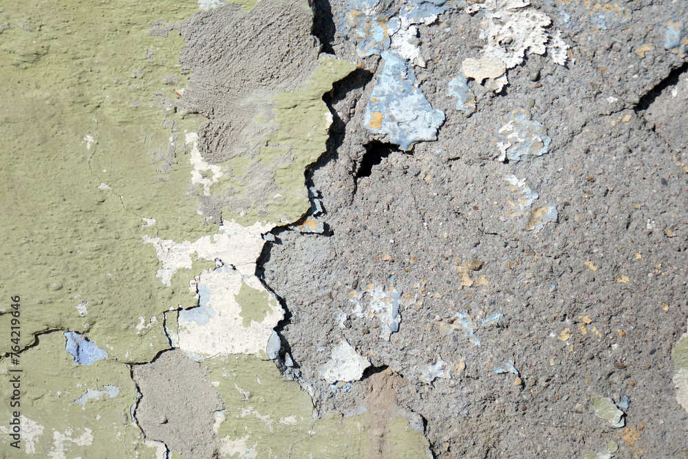 Aged stucco wall texture. Paint is peeling and old. Layers of paints on ...