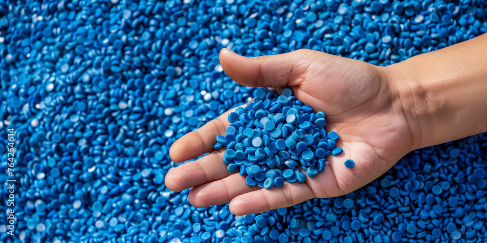 Hand Holding Blue Plastic Resin Pellets for Plastic Manufacturing ...