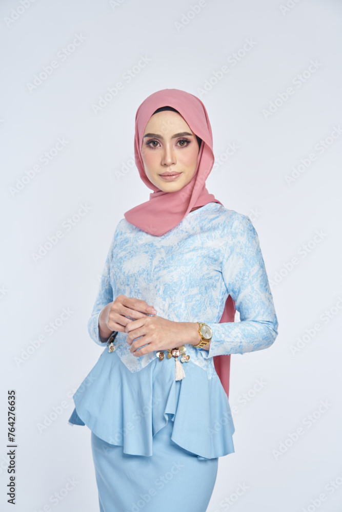 Beautiful female model wearing blue peplum dress with hijab, a modern ...