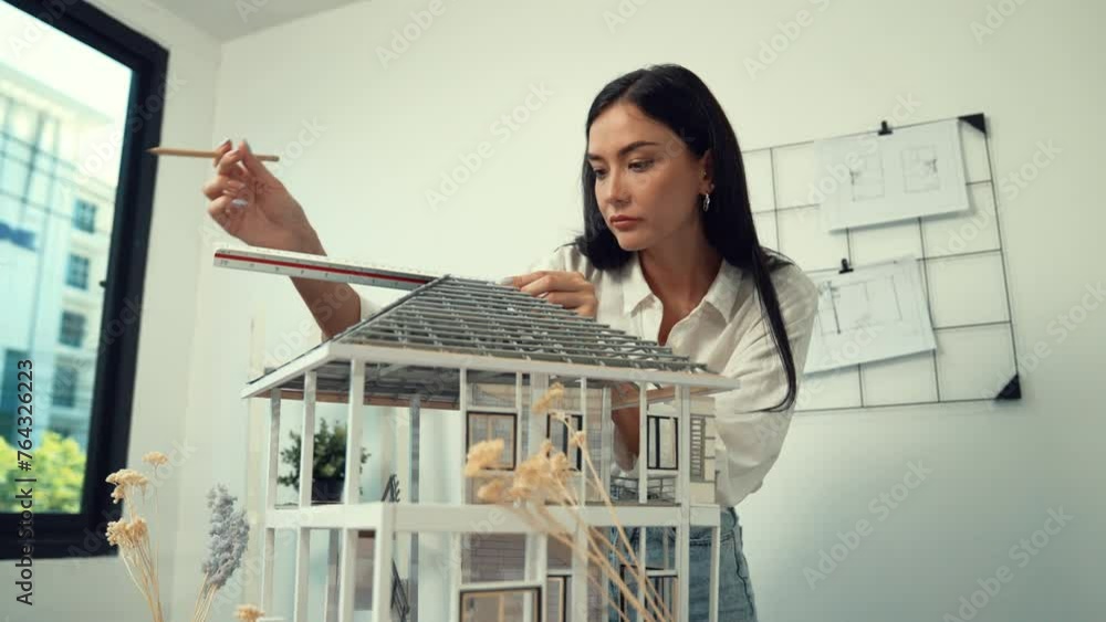 Professional young beautiful architect engineer using ruler and pencil ...