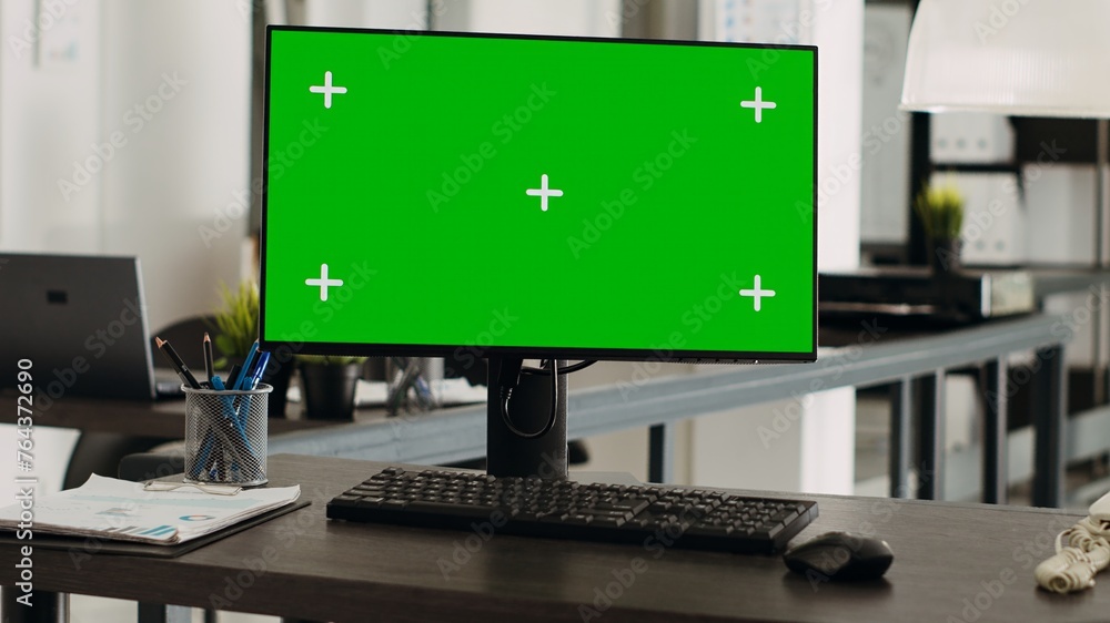 Workstation desk with greenscreen monitor in business agency office ...