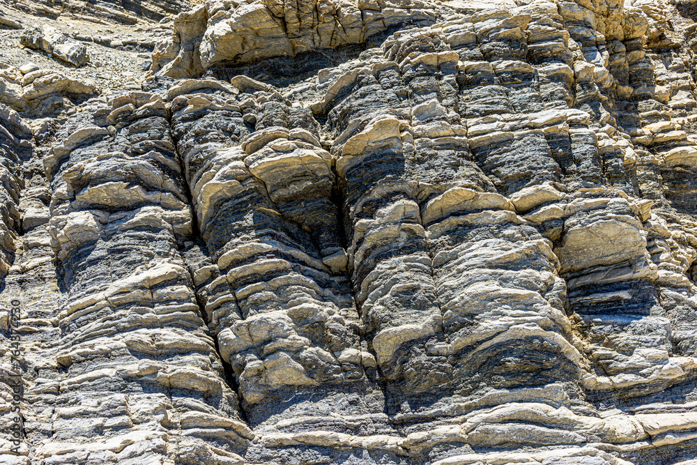 Nature force compressed prominent cracked rock layers structure ...