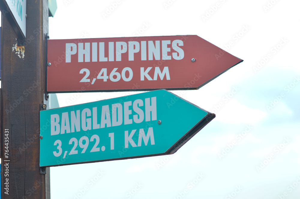 Close-up shots of directional signs pointing towards the enchanting ...