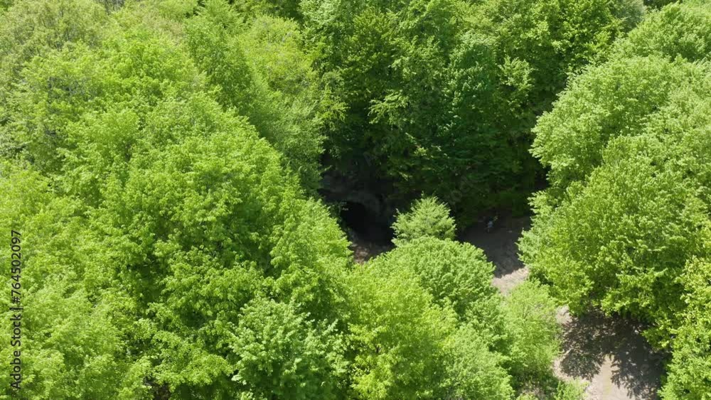 Panning overhead drone shot moving above the site known as the location ...