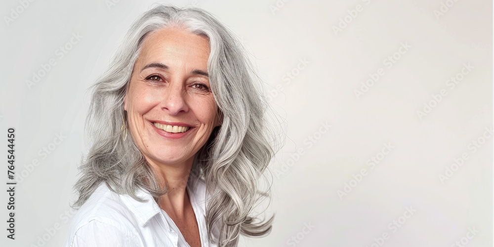 beautiful smiling elderly woman with gray hair on white background ...