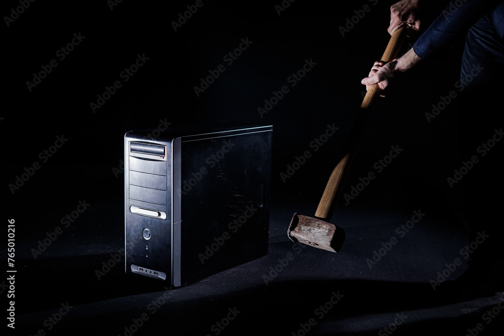 Blow of a large, heavy hammer with a long handle onto a desktop ...