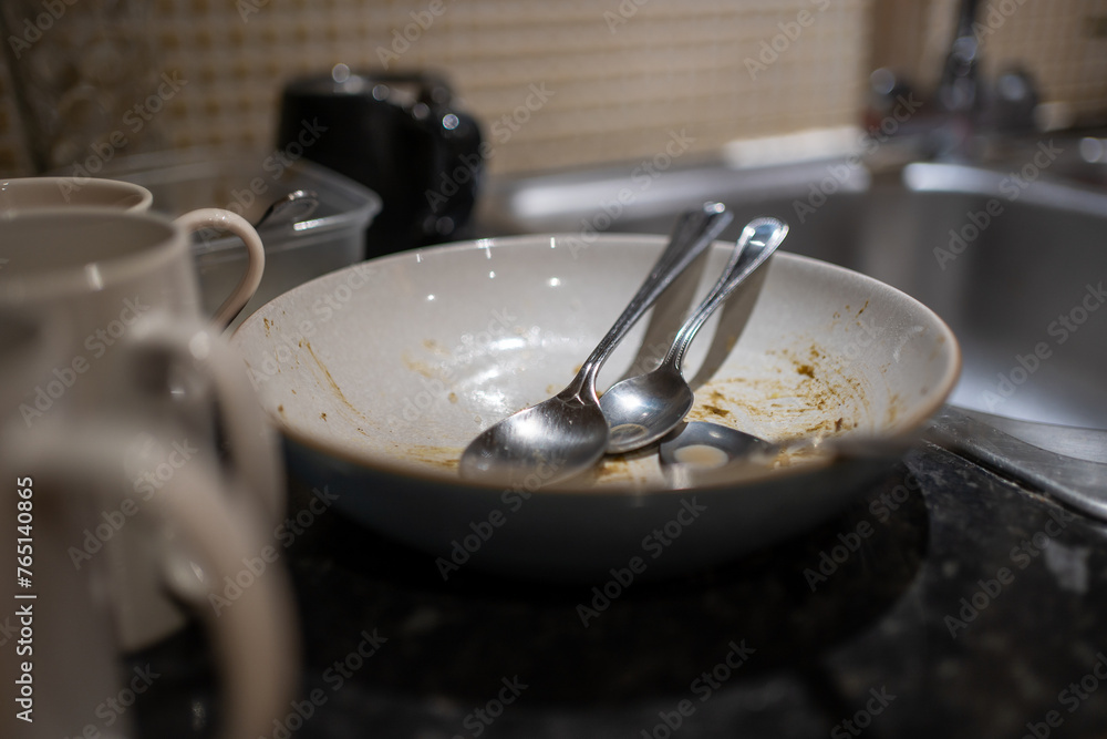 Dirty dishes at night time in the kitchen. Chores to be done at the end ...