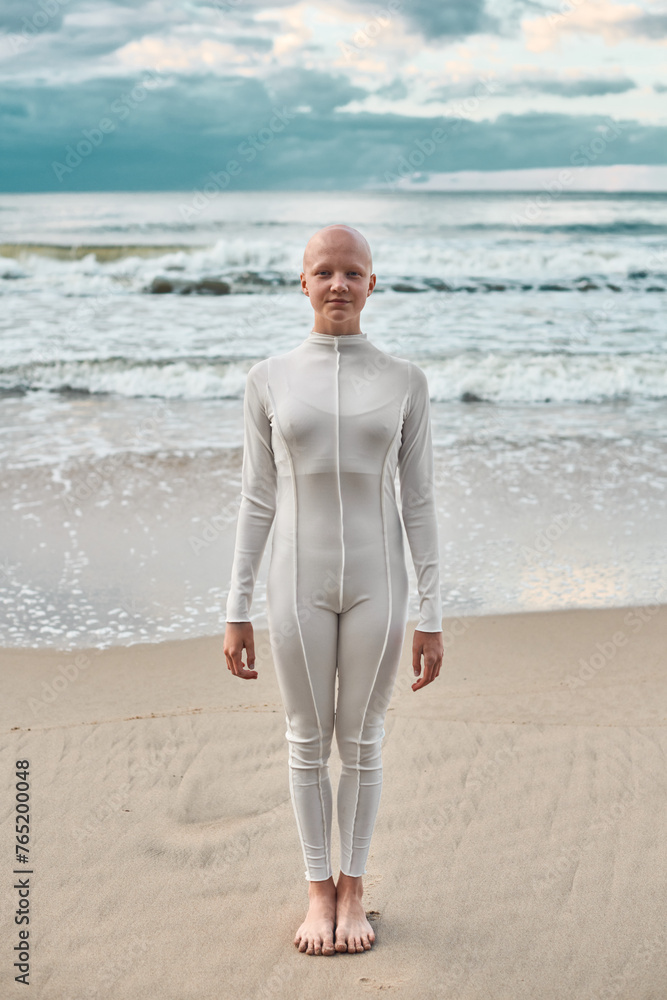 Full length portrait of young hairless girl with alopecia in white ...