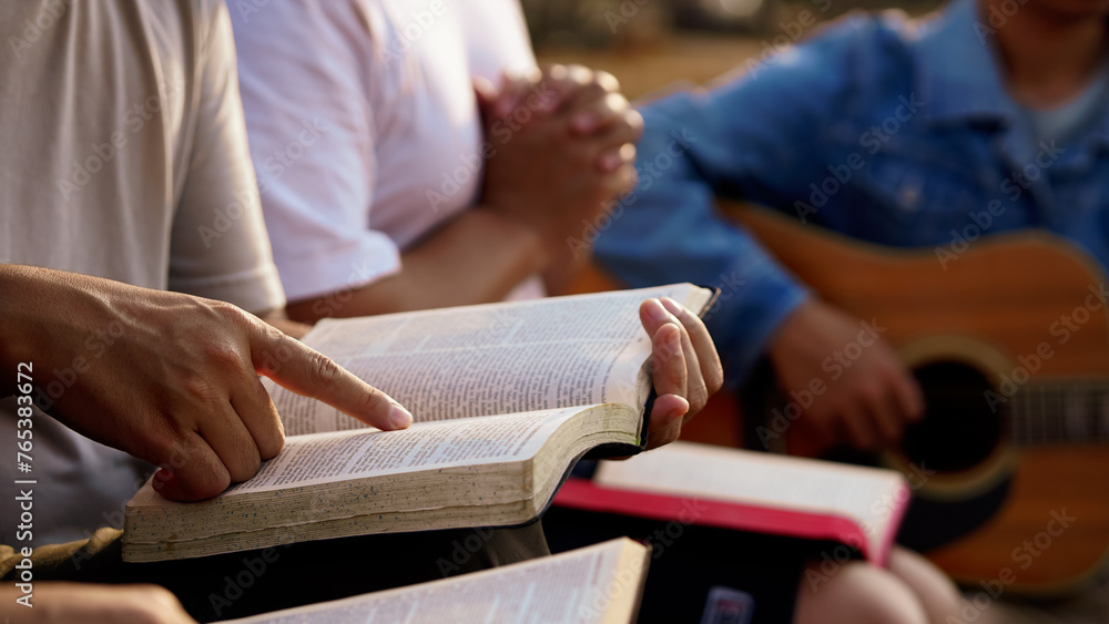 The people read and studied the bible at the park and prayed together ...