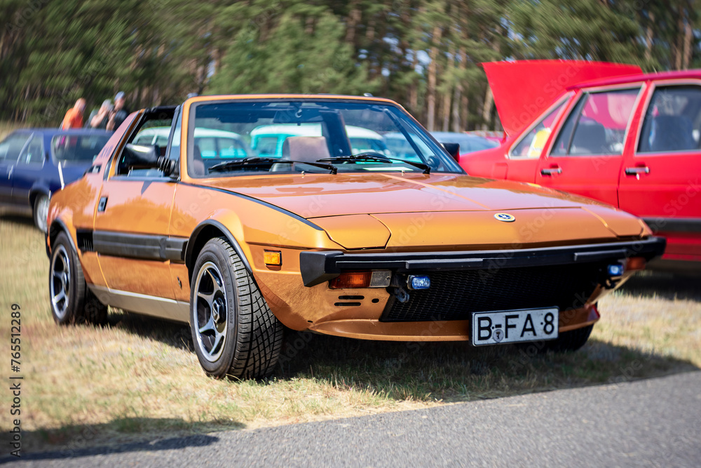 LINTHE, GERMANY - MAY 27, 2023: The sports car Bertone X1/9 (Fiat X1/9). Art lens. Swirl bokeh ...