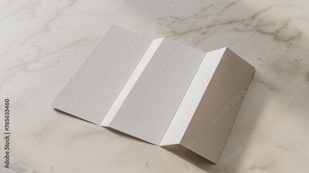 Blank white folded paper brochure mockup on marble background. Tri-fold ...