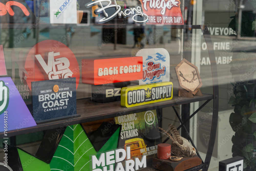 cannabis shop window display with brand logos on Queen Street West in ...
