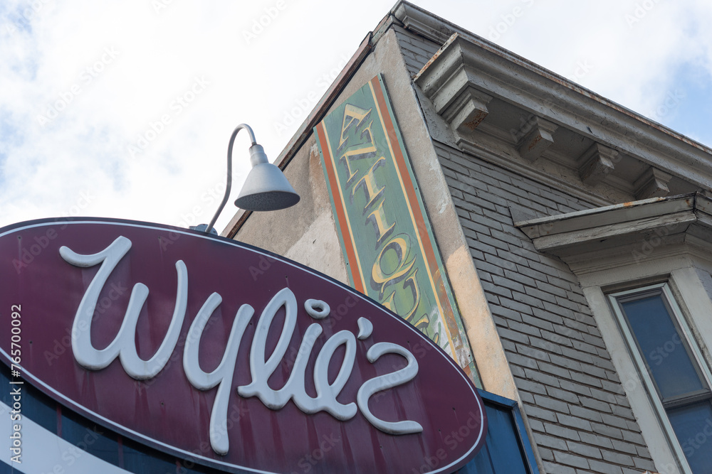 vintage antiques sign on the side of a building (and outdoor sign for ...
