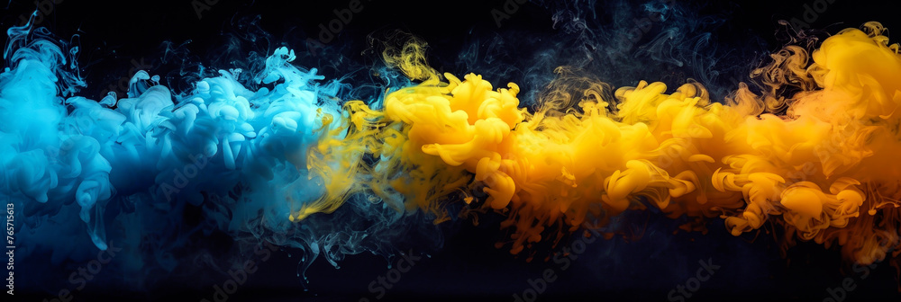 Colorful blue and yellow smoke merging and swirling while flowing on ...