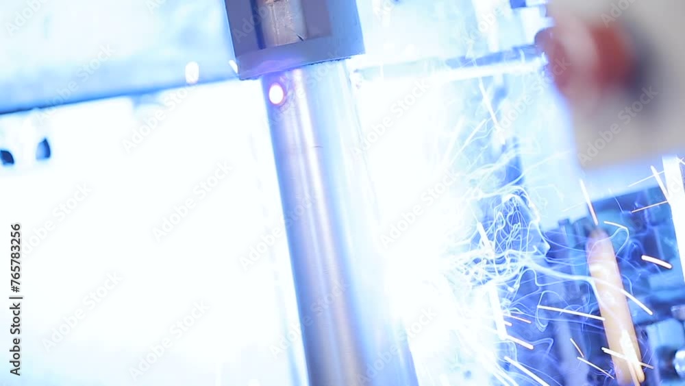 automatic machine welding process on steel metal rod piece. two or more ...