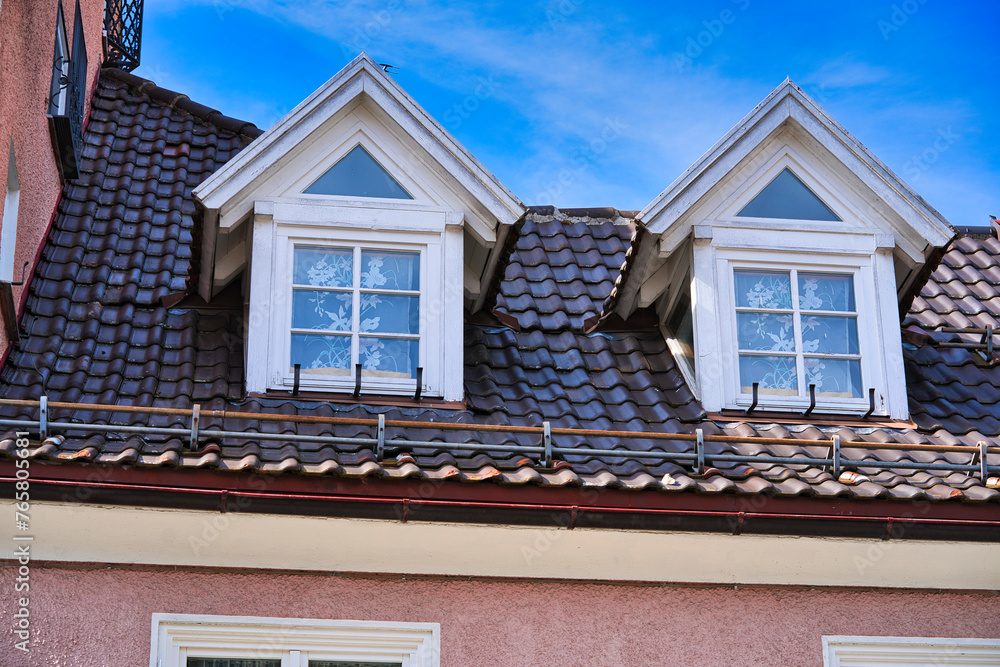 typical dormer windows of a German town on a pitched roof and tiles ...