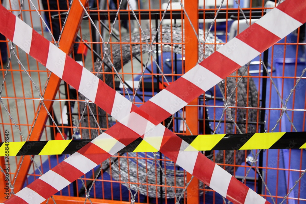 White and red striped ribbons danger cross sign and fence for fire ...