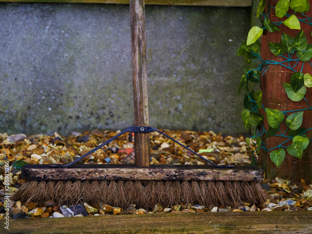 sweeping broom outside with concrete background and leaves Stock Photo ...