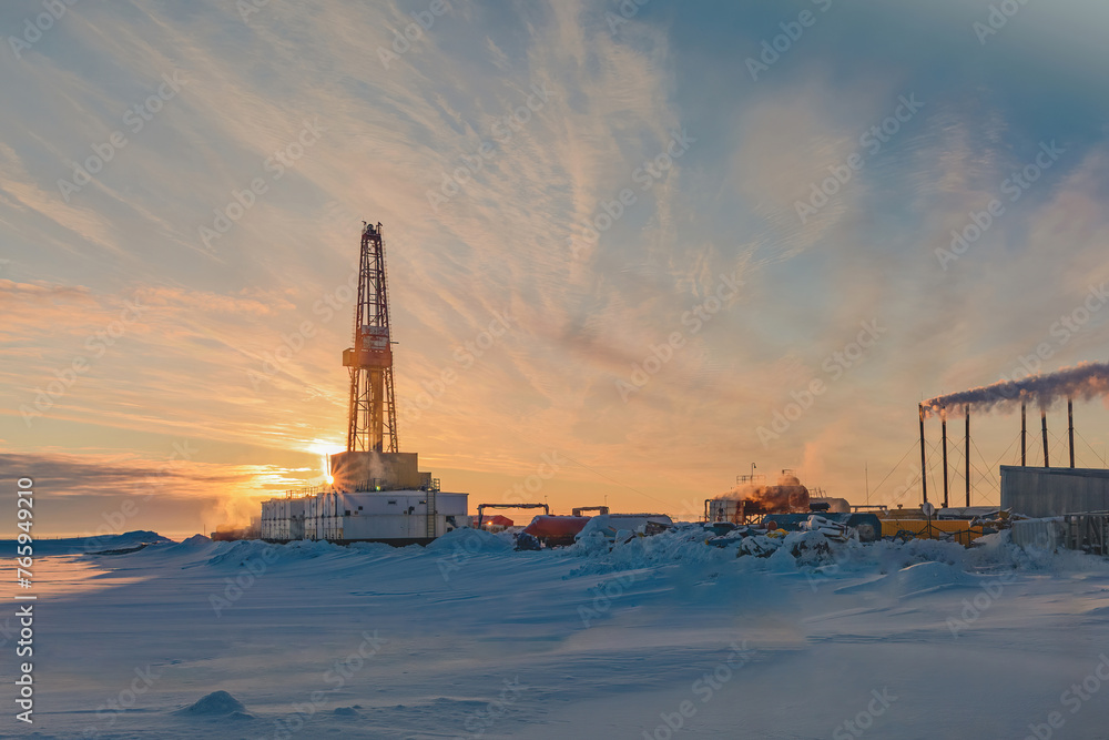Drilling wells in an Arctic oil and gas field. Polar day sunrise in the ...