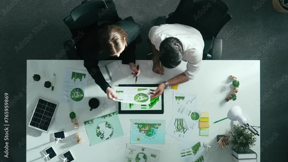 Top down view of business man presenting sustainable idea to manager by ...