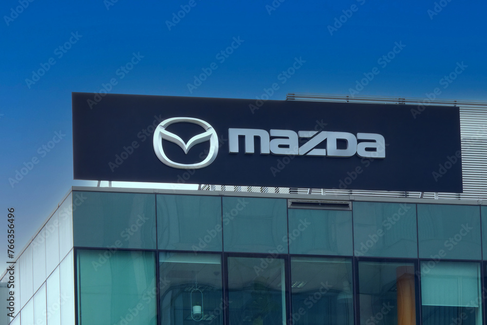 Mazda logo on car dealership building - Mazda is a Japan multinational ...