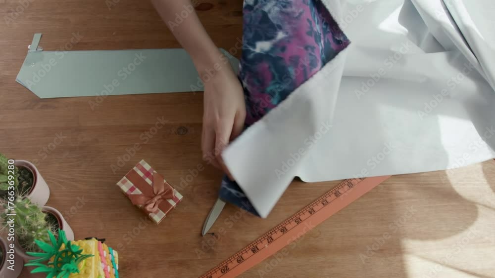 Female tailor hands draw sew pattern ruler and felt tip pen on desk ...