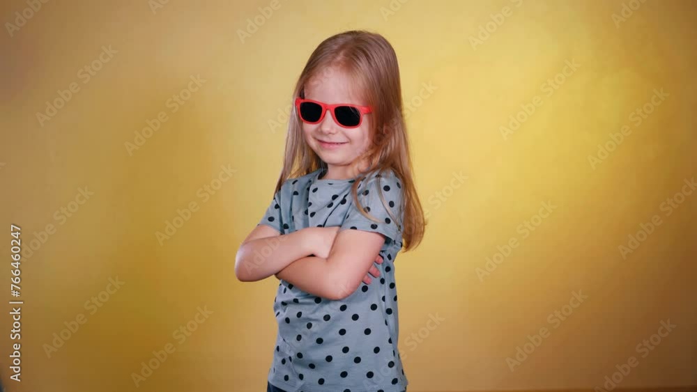 Confident little girl standing with arms crossed. Determined child with ...