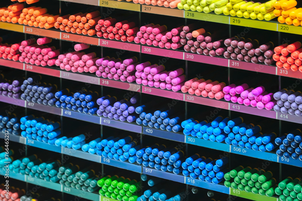 A colorful display of pens and pencils with the numbers 1 through 7 on ...
