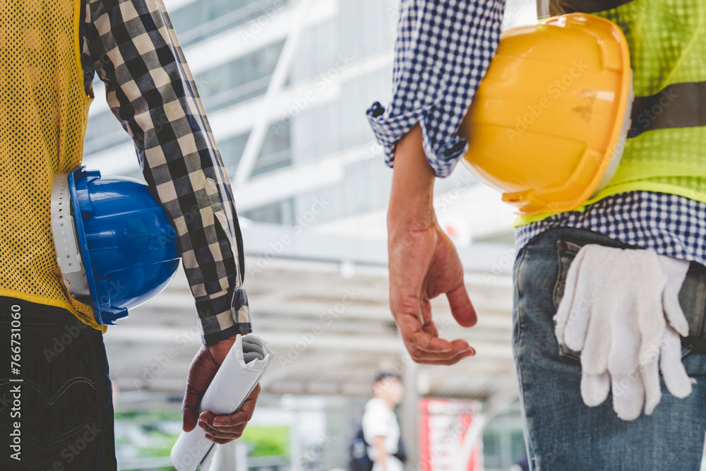 Helmet construction Engineer team. Men hands holding hardhat yellow ...
