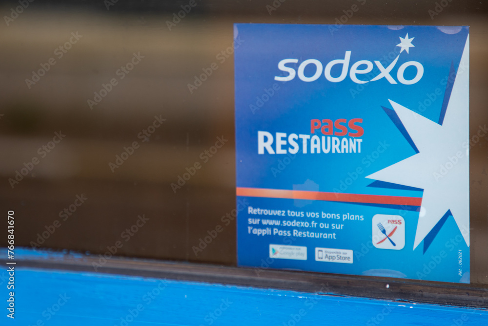 Sodexo brand logo and text sign label front entrance of bar door window ...