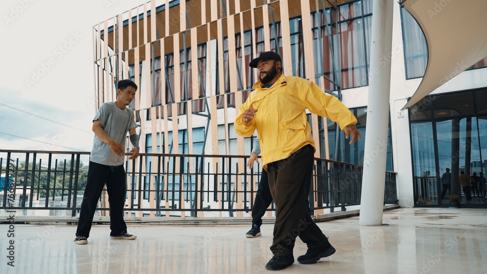 Foto de Hip hop team dance break dance while multicultural friend ...