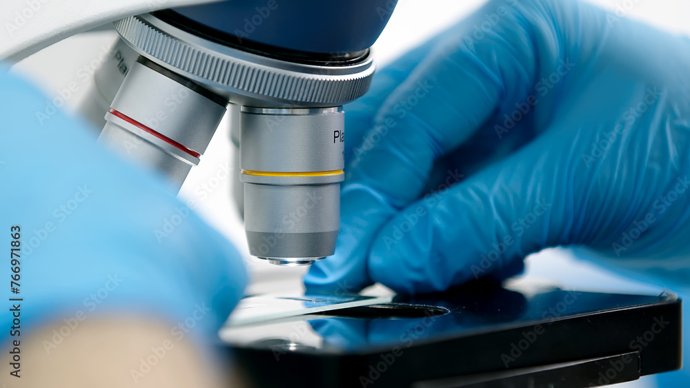 Using a high-tech microscope, scientists examine the sample in a modern ...