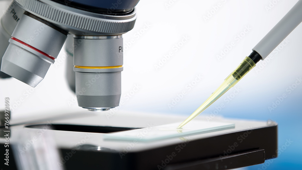 Using a high-tech microscope, scientists examine the sample in a modern ...